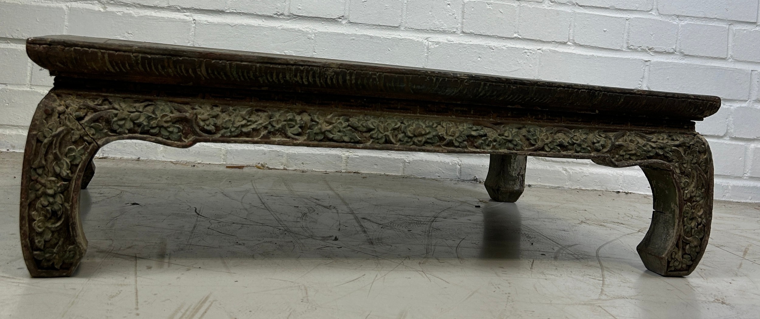 Lot 304 - CHINESE HEAVILY CARVED LOW TABLE IN THE MING