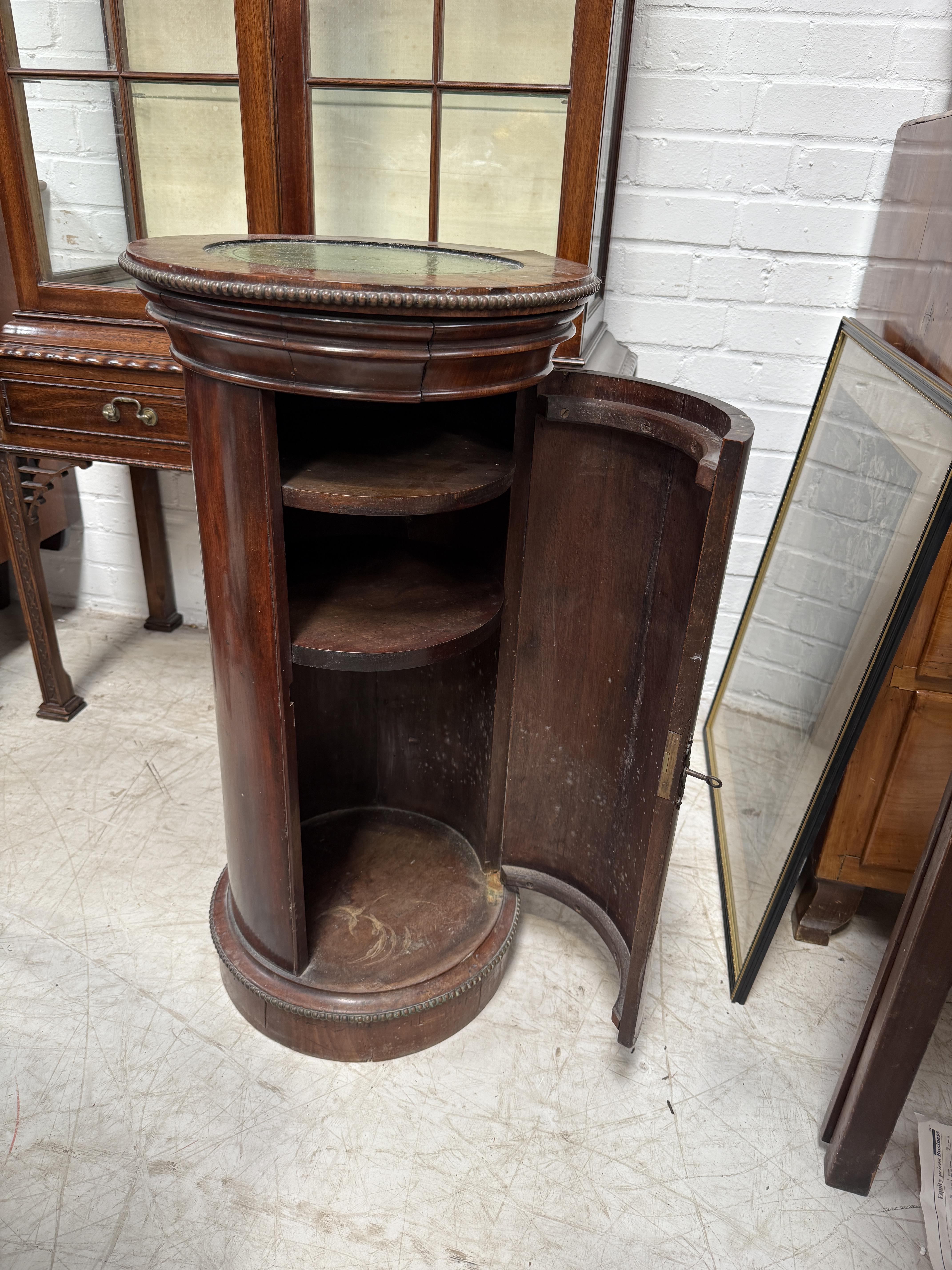 Lot 821 - A GEORGIAN CIRCULAR CABINET WITH TOOLED