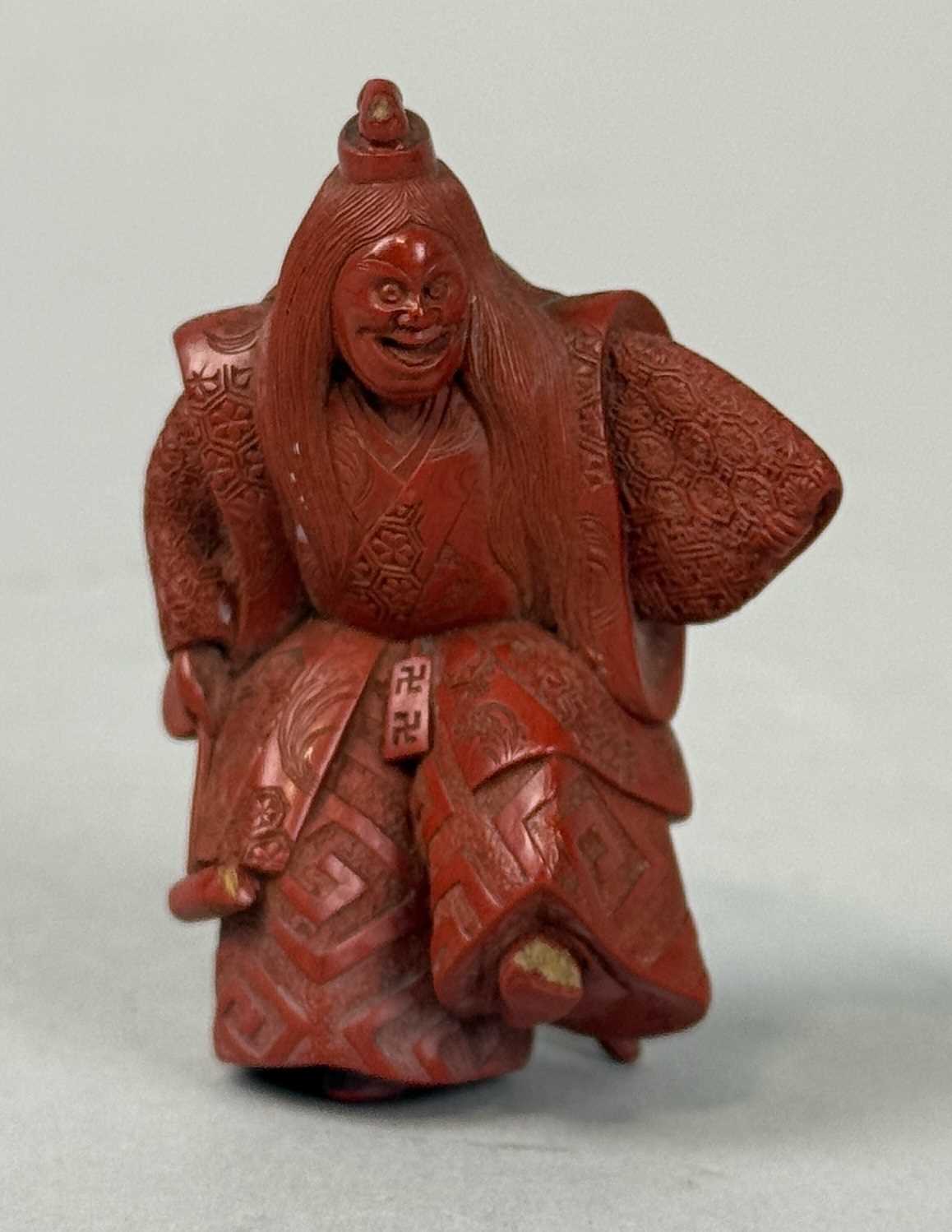 Lot 272 - A JAPANESE RED LACQUERED NETSUKE DEPICTING A